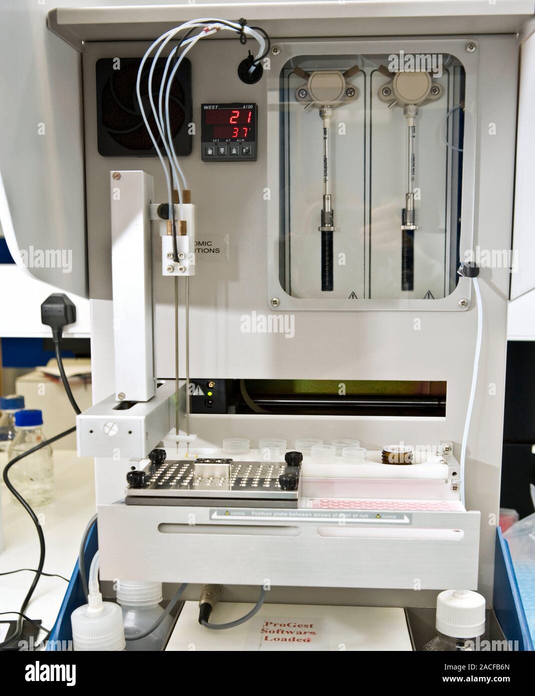 Protein analysis. Samples inside a protein digester robot. This machine ...