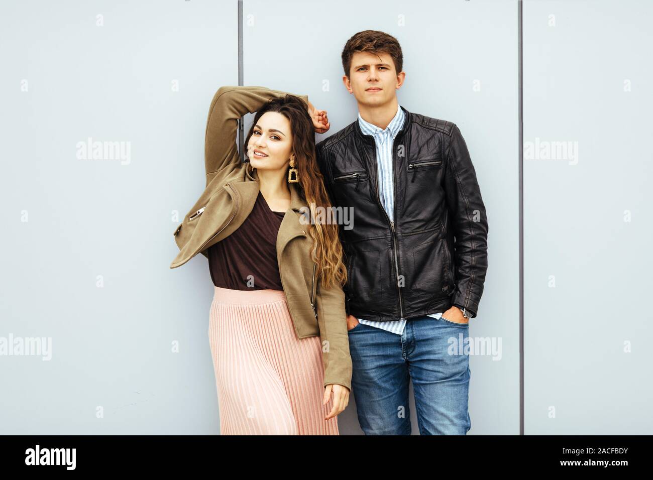 Happy loving couple isolated on gray background. stylish image, good ...