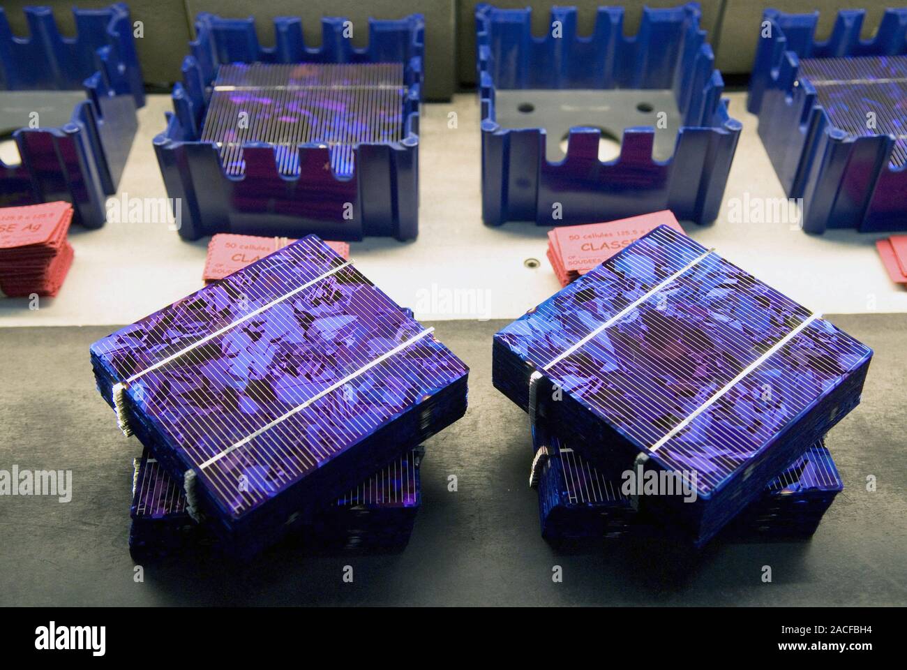 Solar cell production. Stacks of photovoltaic cells sorted by power ...