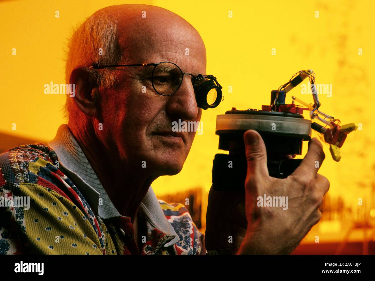 Robotics research. Researcher holding a Swarm-Bot. Based on the ...