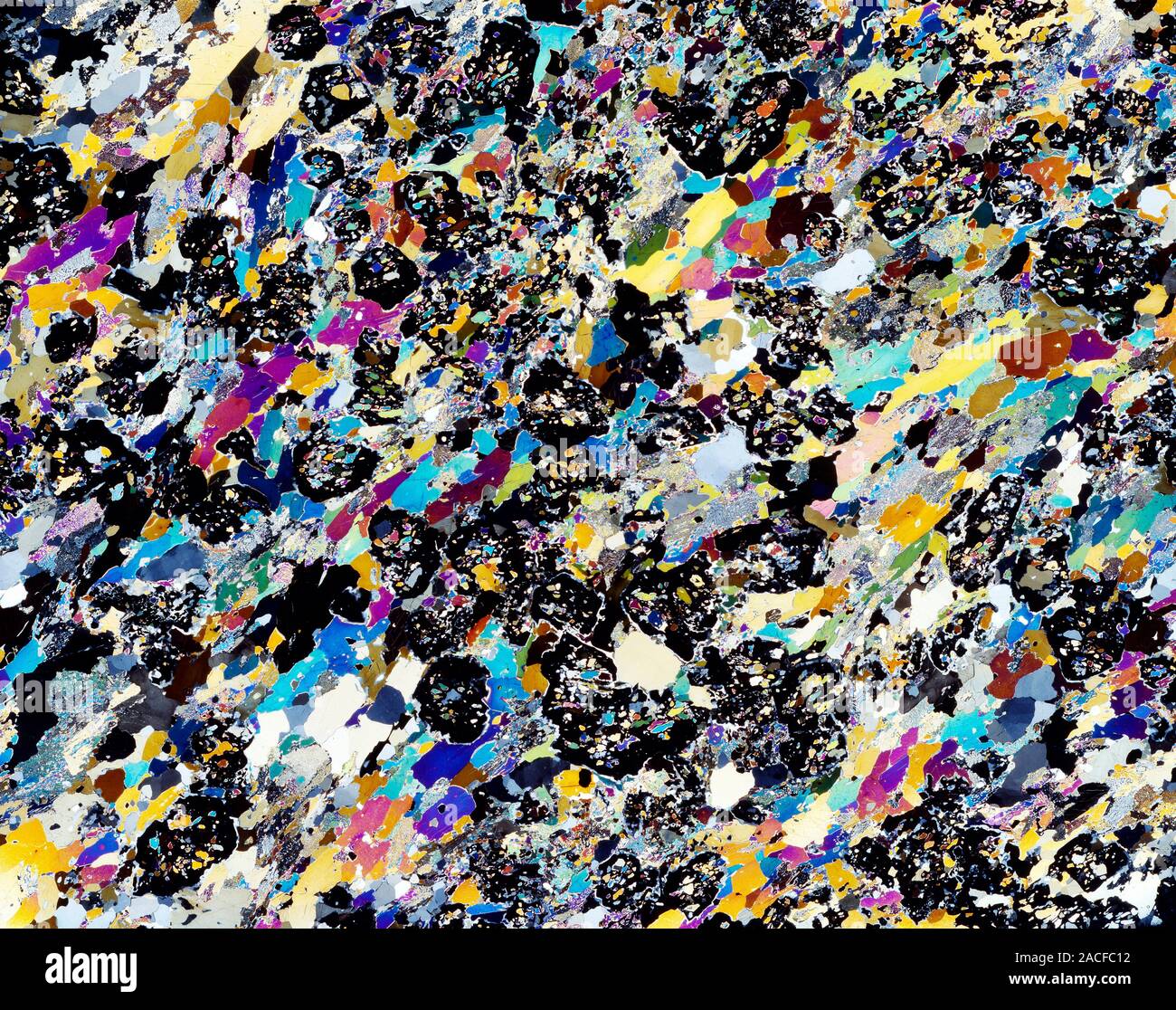 Retrograde eclogite rock. Polarised light micrograph showing how ...