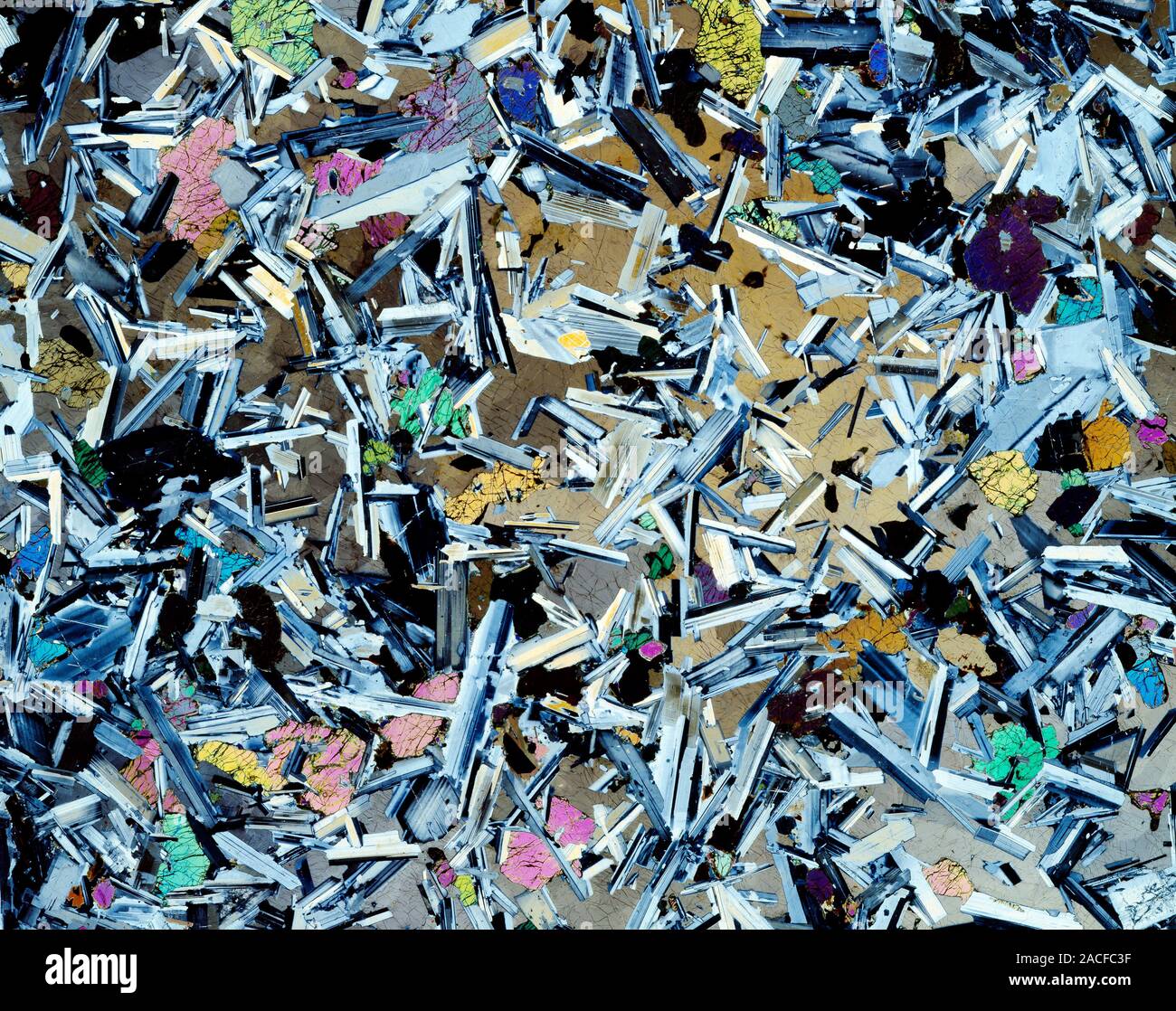 Gabbro rock. Polarised light micrograph of gabbro, a coarse-grained ...