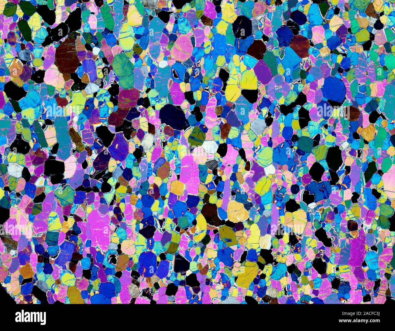 Dunite rock. Polarised light micrograph of dunite, an ultramafic (low ...