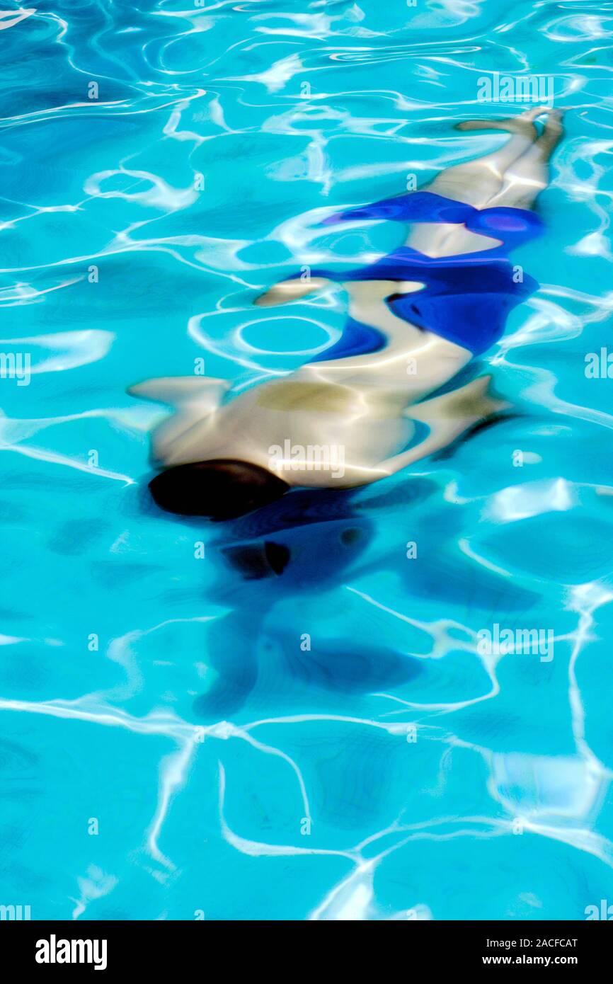 Man swimming underwater in a pool Stock Photo - Alamy