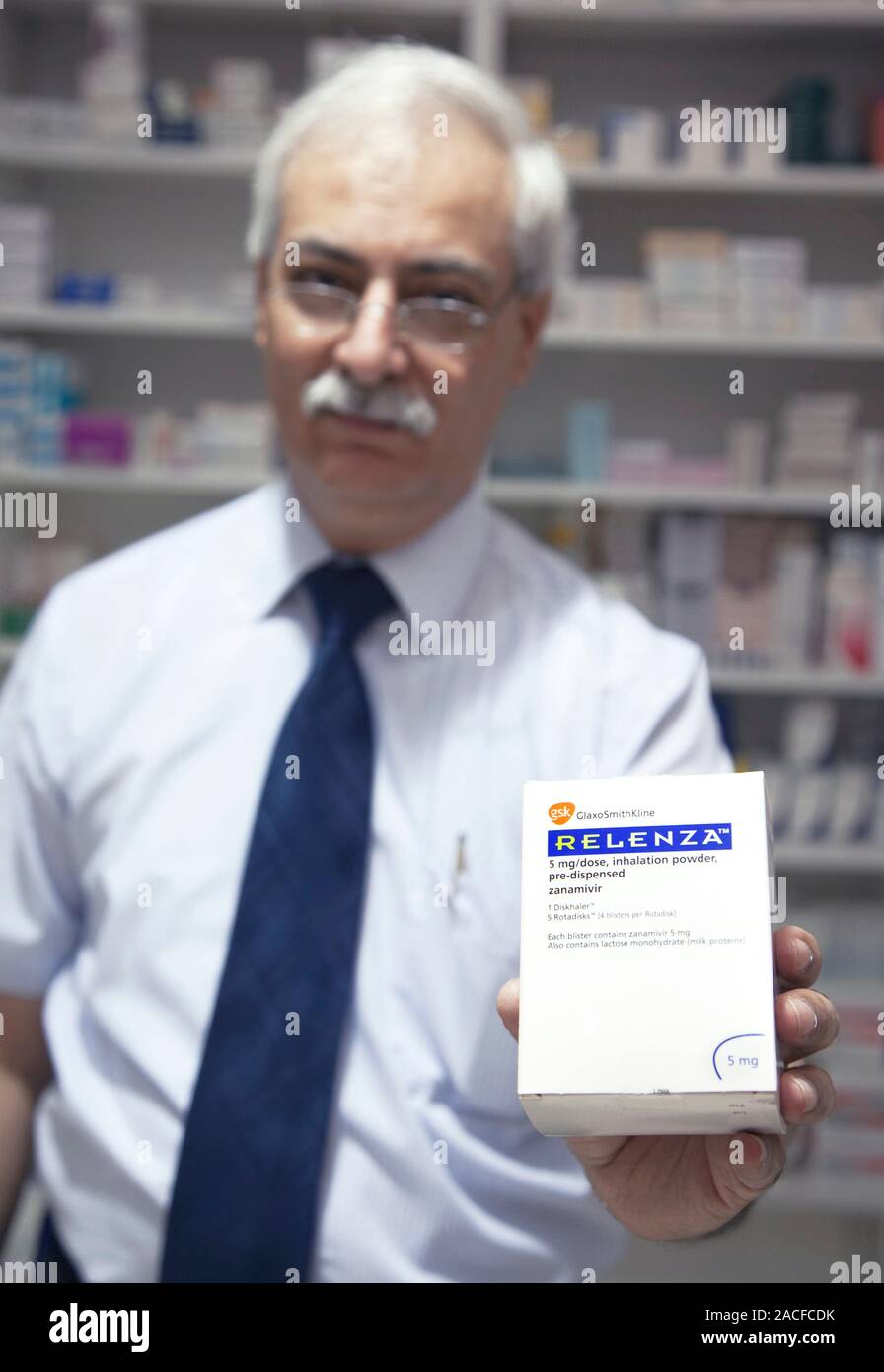 Pharmacist with Relenza packet. Relenza is the trade name for the ...