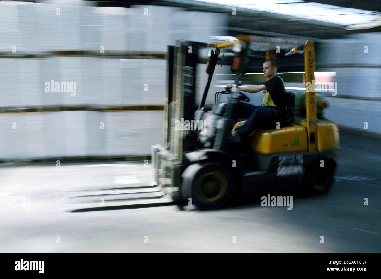 Fork-lift truck in a loading bay. Photographed at the loading bay in Le ...