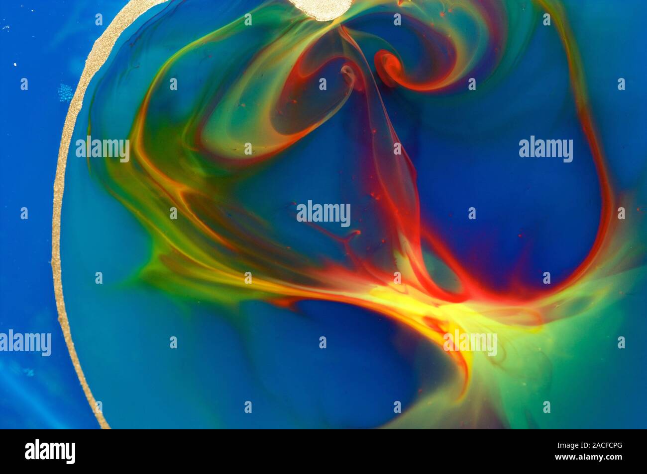 Ink patterns in water. Close-up of ink spreading in water mixed with ...