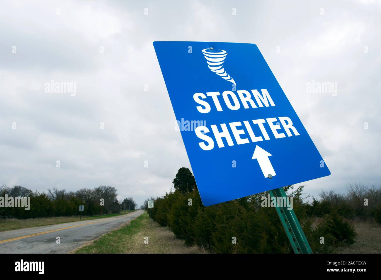 Storm shelter sign. This roadside sign directs the public to safety ...