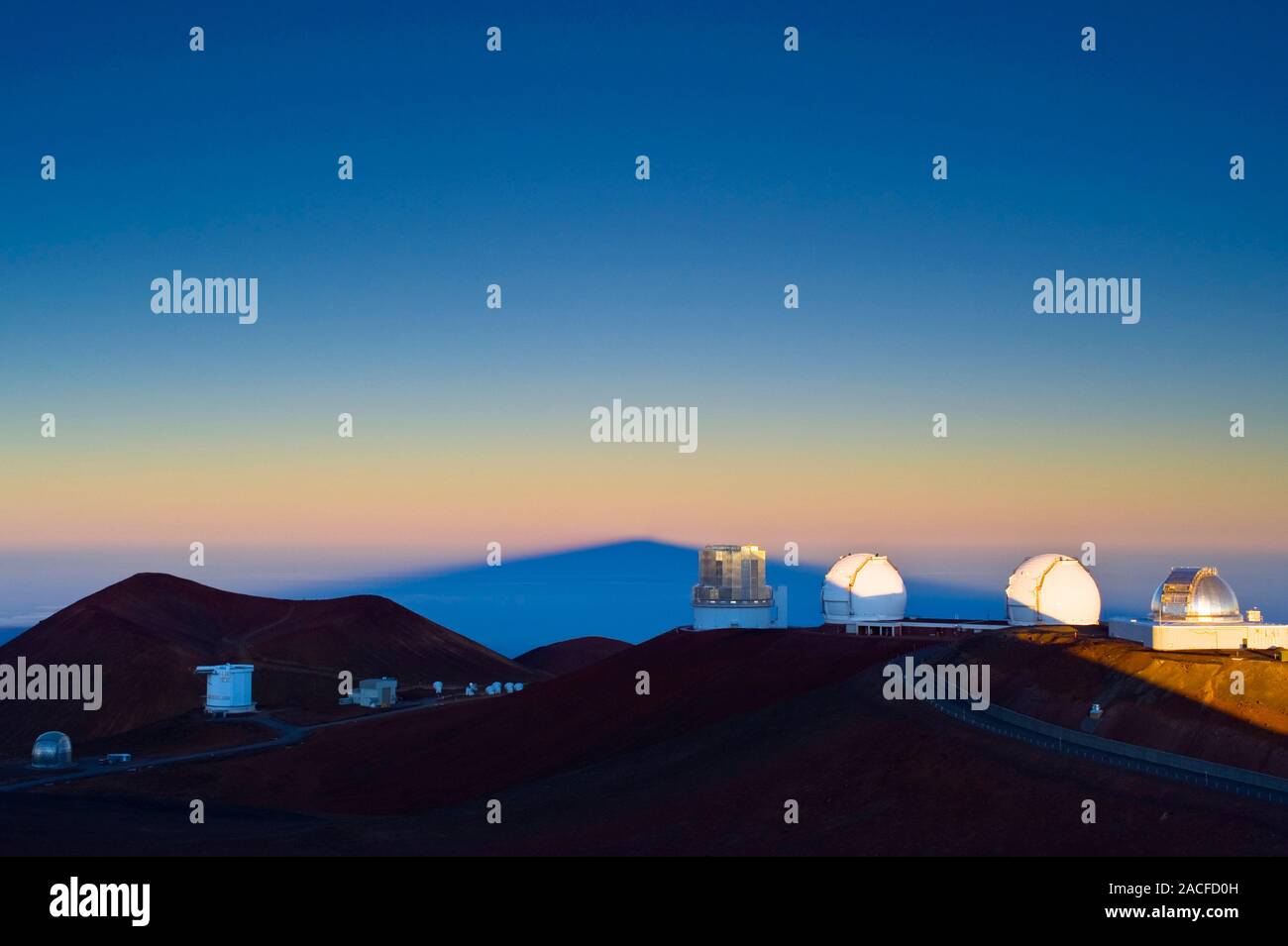 Observatories on Mauna Kea, Hawaii, at sunrise. Left to right they are ...