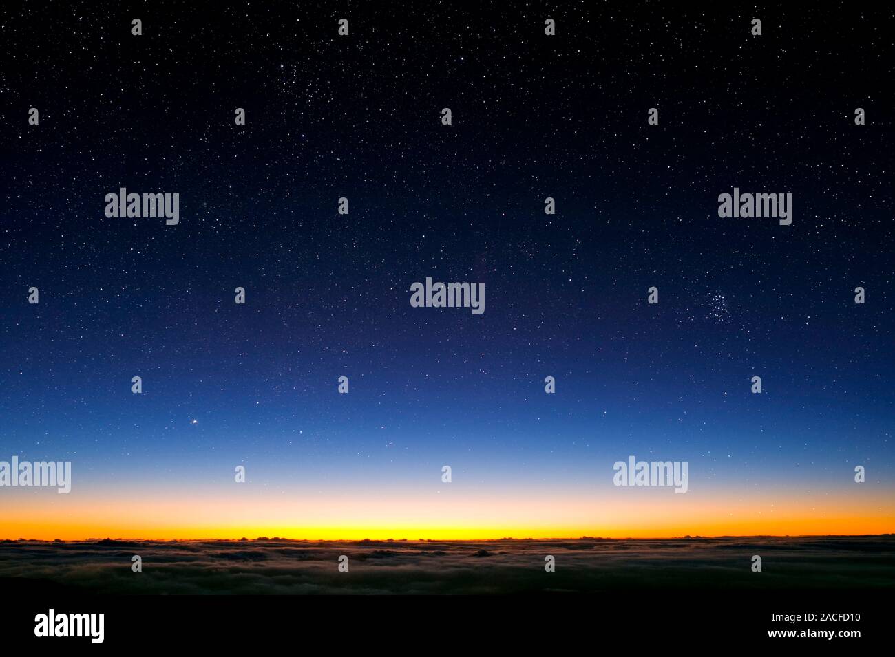 Night sky. Field of stars above the clouds at dawn. Photographed at ...