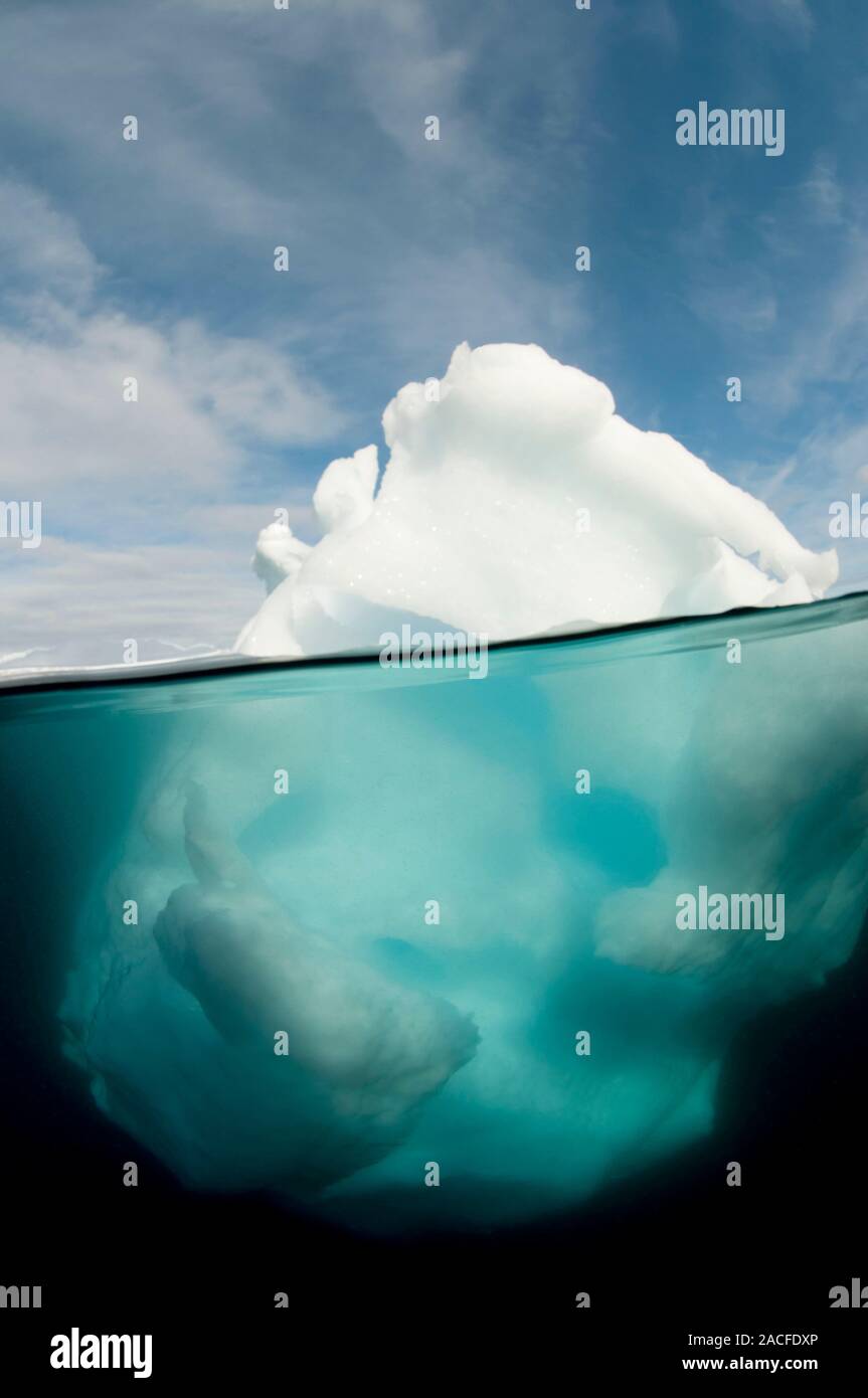 Antarctic iceberg. Split view, above and below water, photograph of an ...