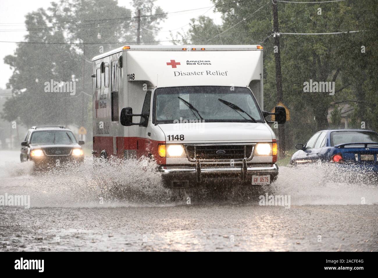Hurricane emergency response. American Red Cross vehicle navigating ...