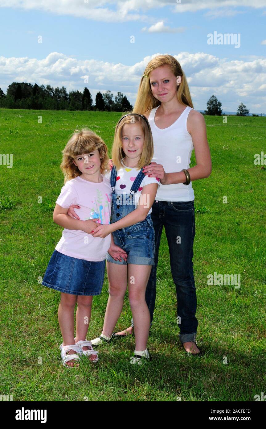 Girl with growth disorder. Young girl (centre) with dyschondrosteosis ...