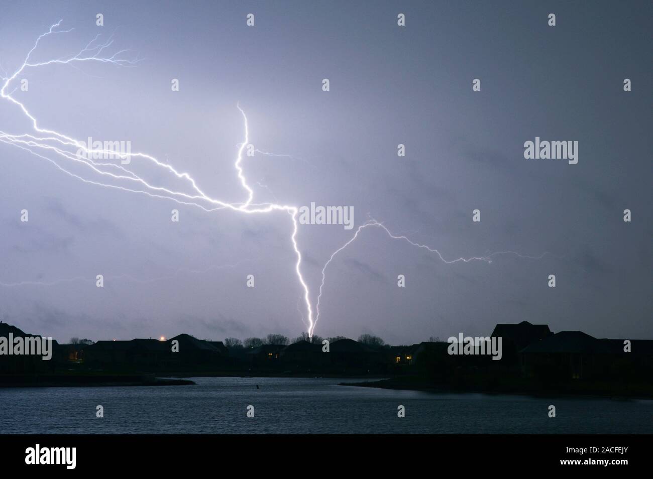 Reverse lightning. Ground-to-cloud lightning strikes a cloud above ...