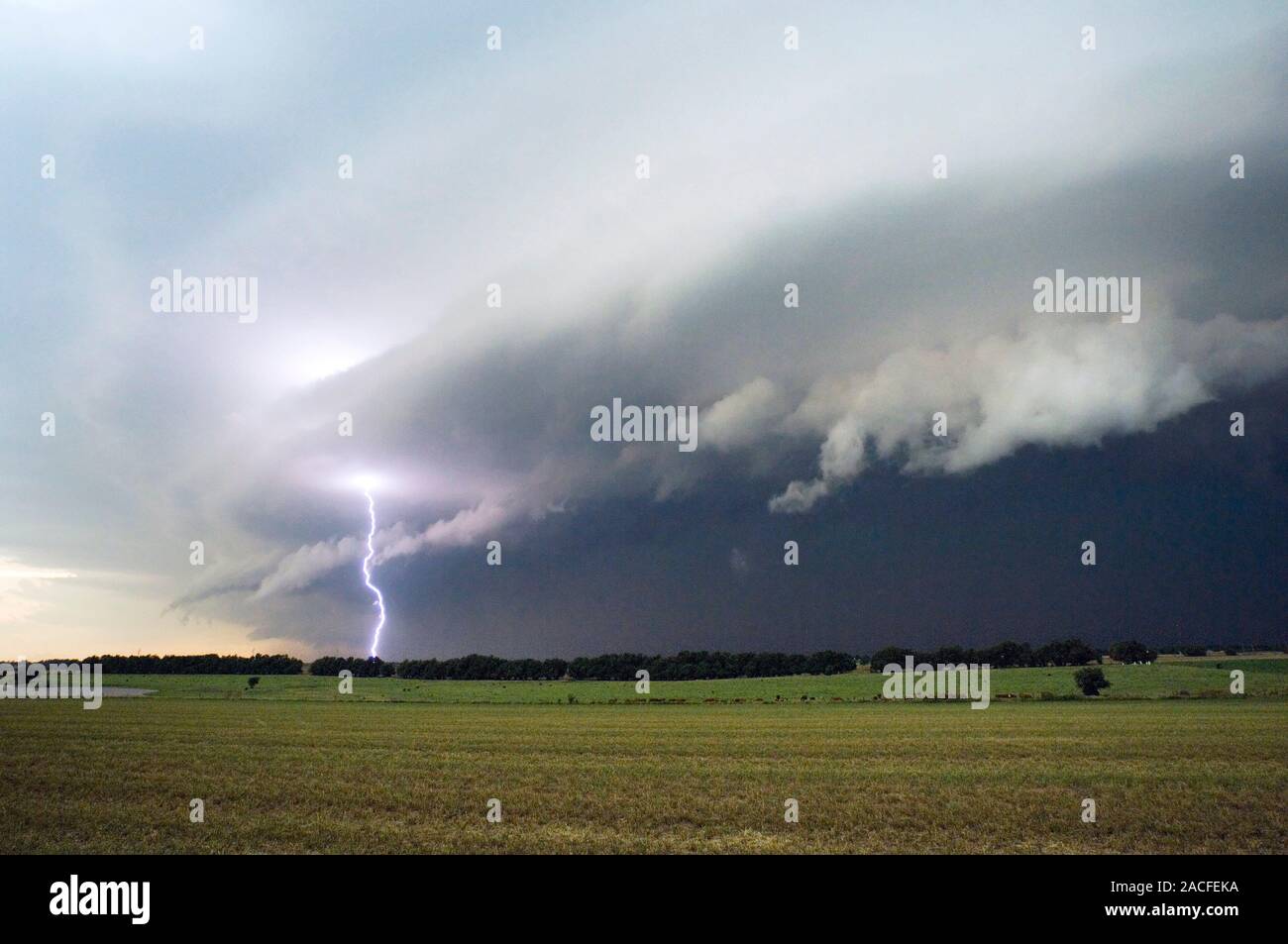 Lightning bolt striking the ground in countryside. Photographed in ...