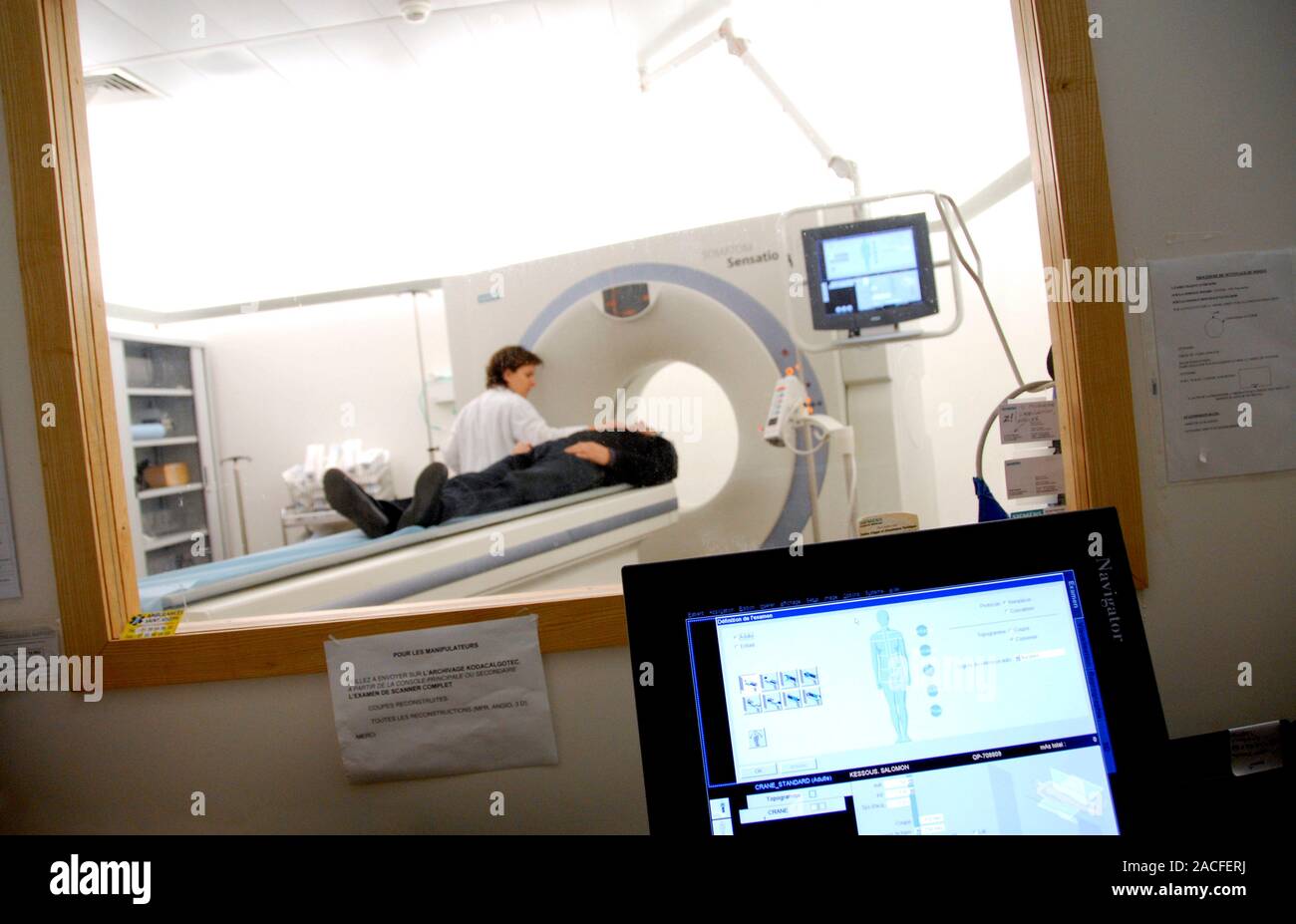 CT scanning. Patient undergoing a computed tomography (CT) scan. CT ...