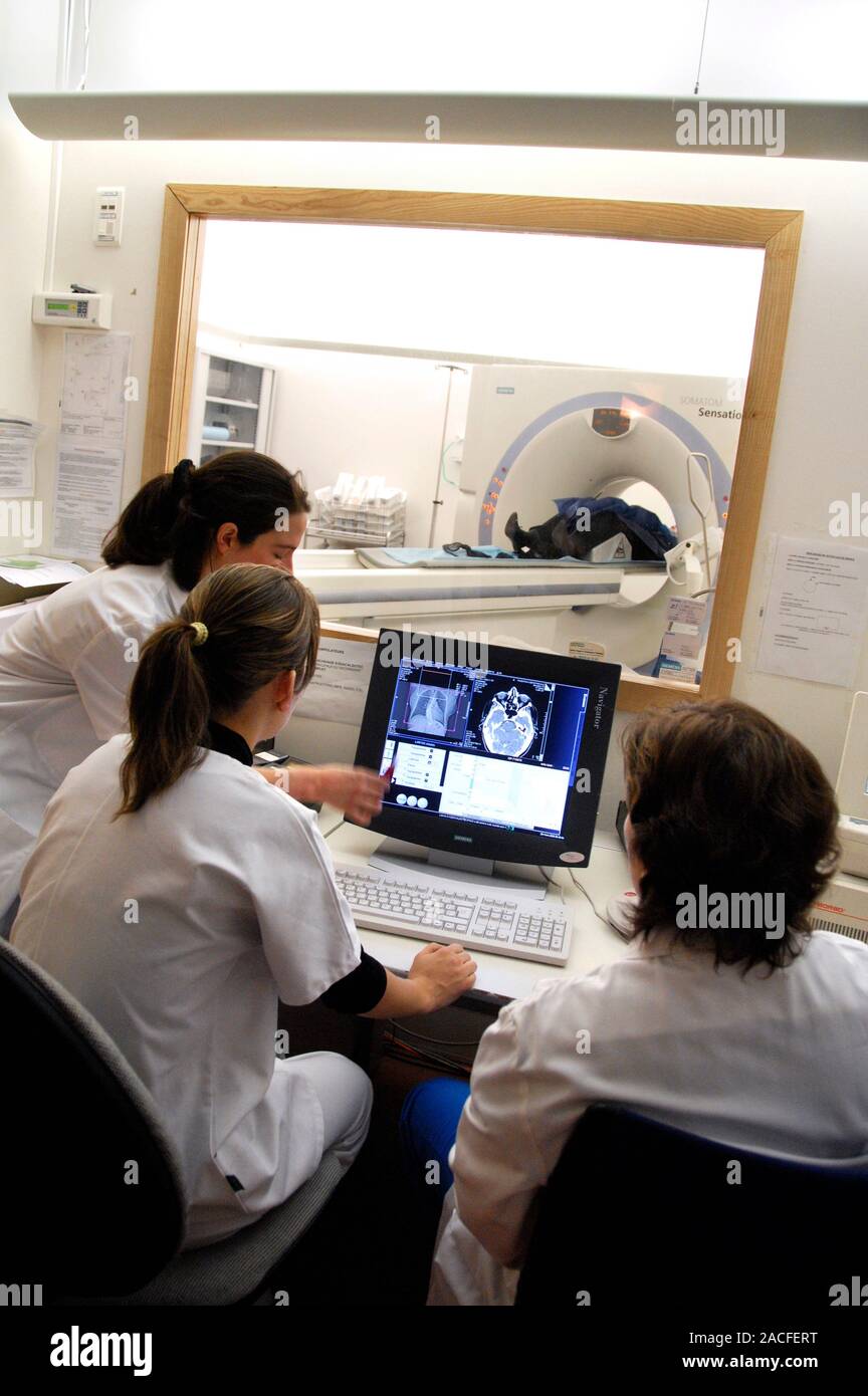 CT scanning. Doctors examining the results of a computed tomography (CT ...