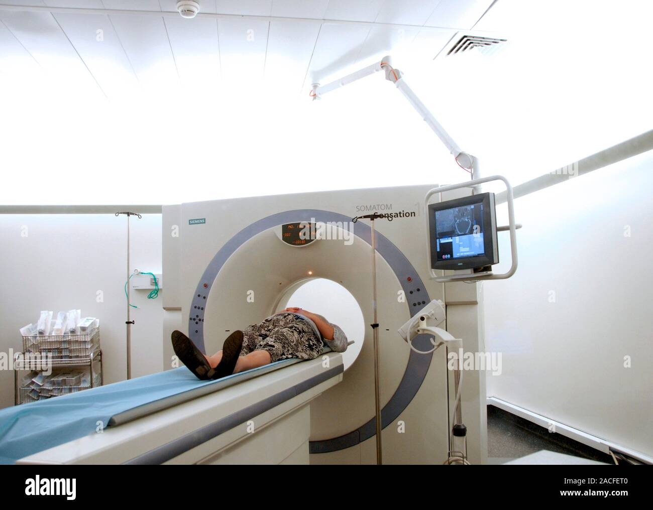 CT scanning. Patient undergoing a computed tomography (CT) scan. CT ...