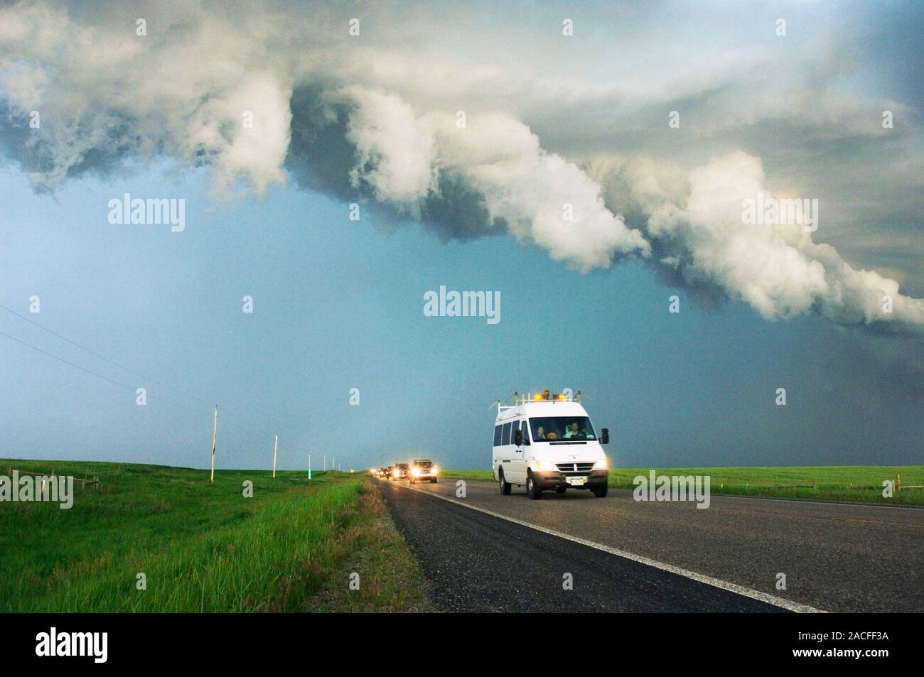 Storm chasers and weather tracker vans following a severe thunderstorm ...