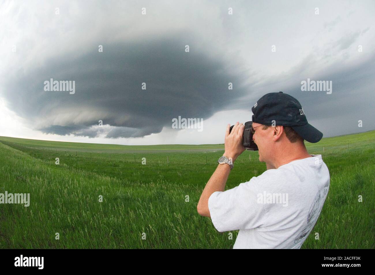 Storm chaser documenting a supercell thunderstorm in South Dakota, USA ...