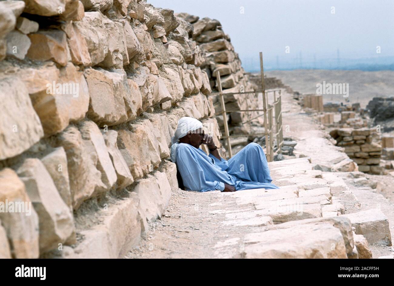 Worker resting at a pyramid site, Egypt. There are more than forty ...