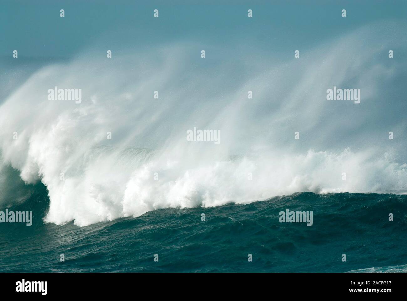 Wind spray at sea. Deep sea wave being blown by storm winds ...