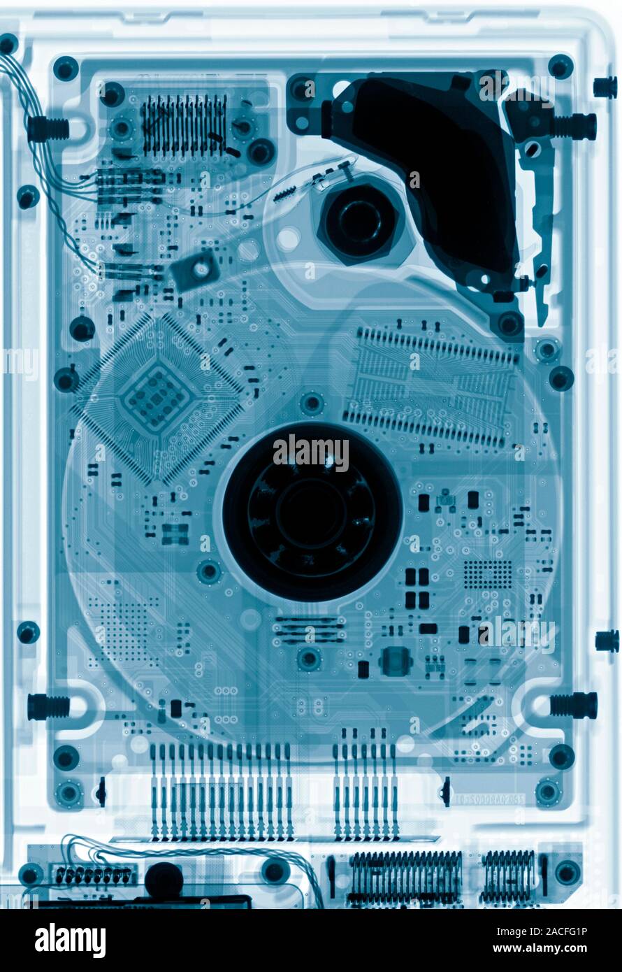 Laptop hard drive. Coloured X-ray of a laptop's hard drive, showing its ...
