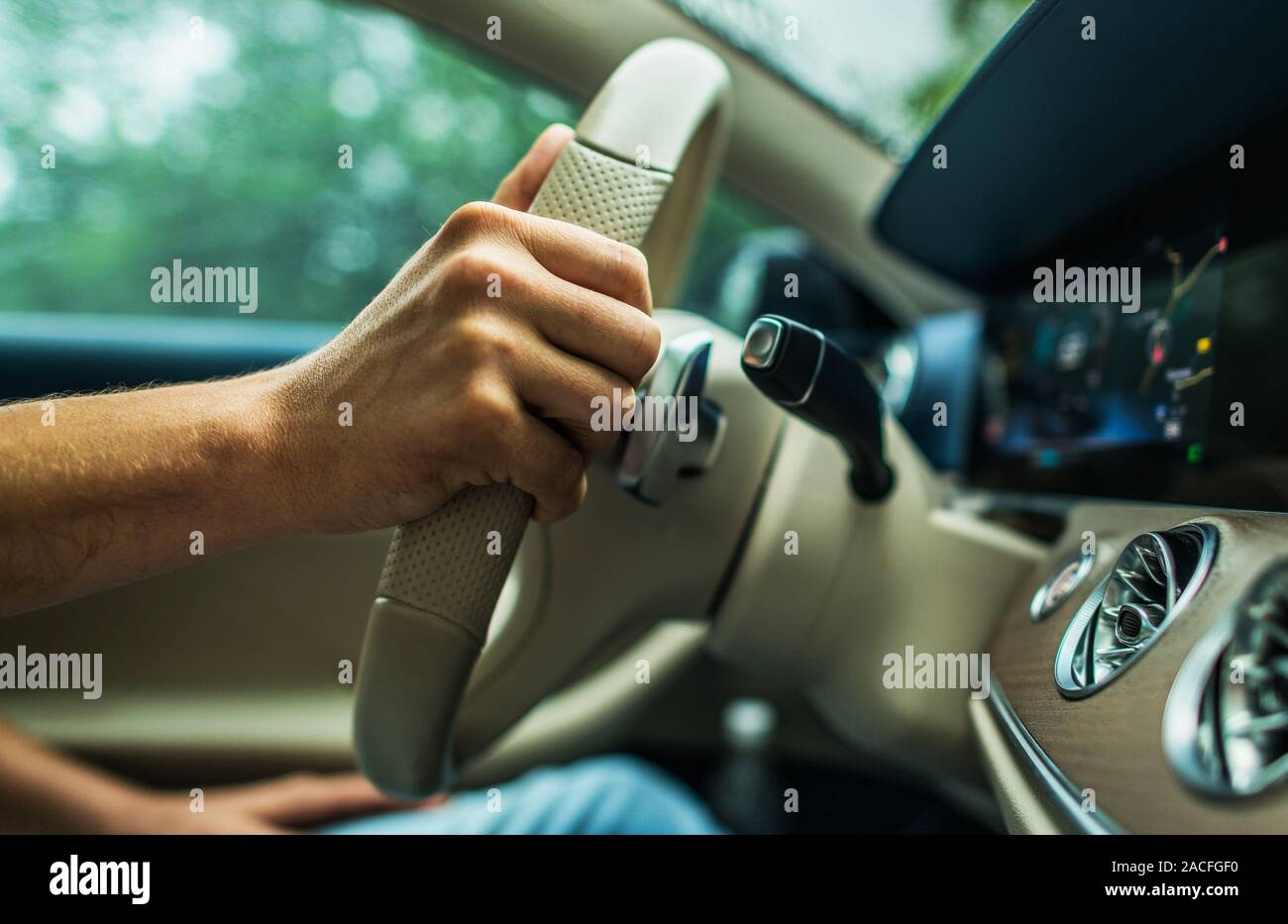 Luxury Car interior and the Caucasian Hand on Steering Wheel. Road Trip ...