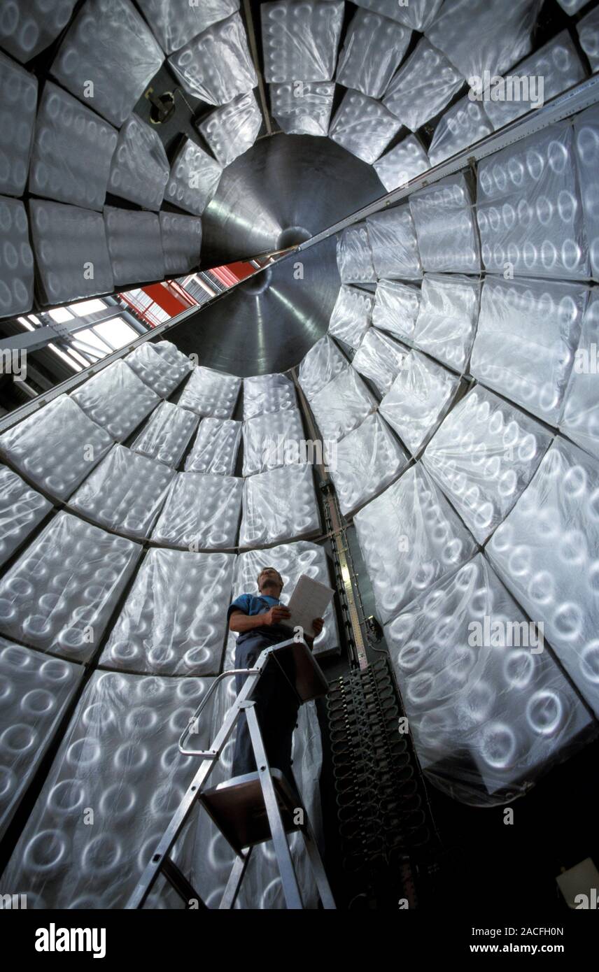 Ariane 5 interior. Engineer checking the assembly of the nose fairing ...