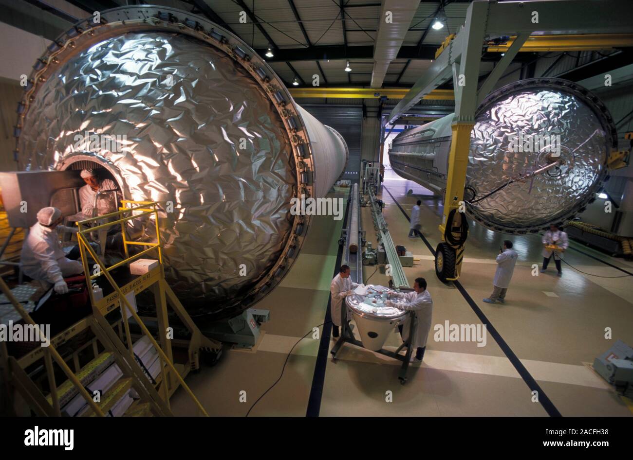 Ariane 5 cryogenic tank production. Workers finishing the production of ...