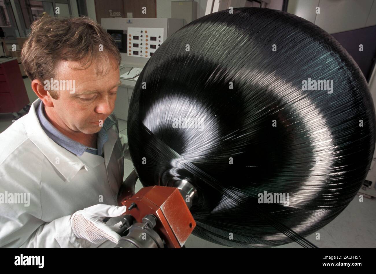 Ariane 5 helium tank. Technician assembling a helium tank for the ...