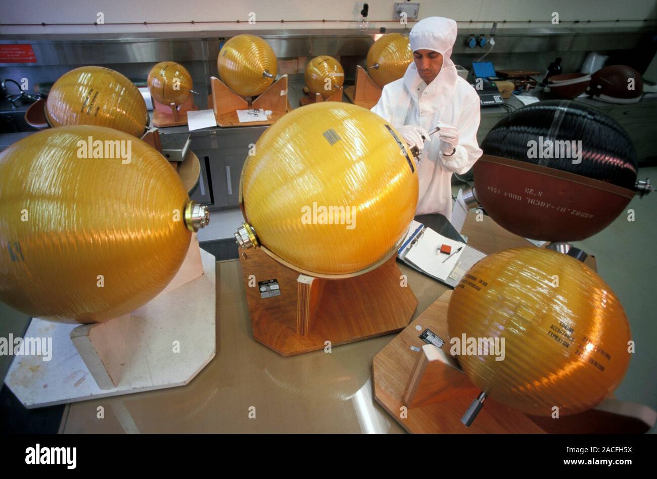 Ariane 5 helium tank production. Technicians assembling helium tanks ...