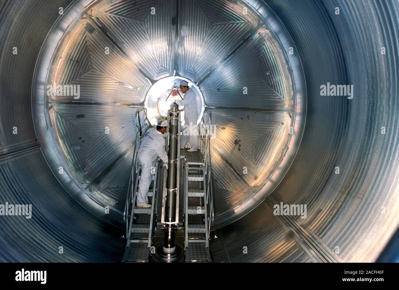 Ariane 5 cryogenic tank production. Workers finish assembling the ...