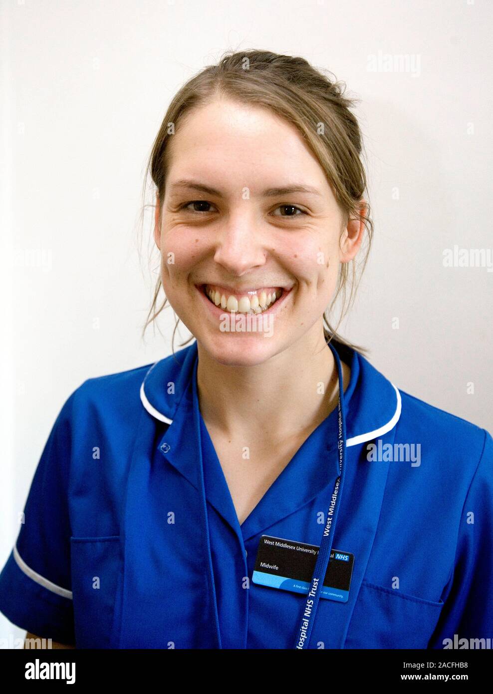 Midwife smiling. Photographed at the West Middlesex University Hospital ...