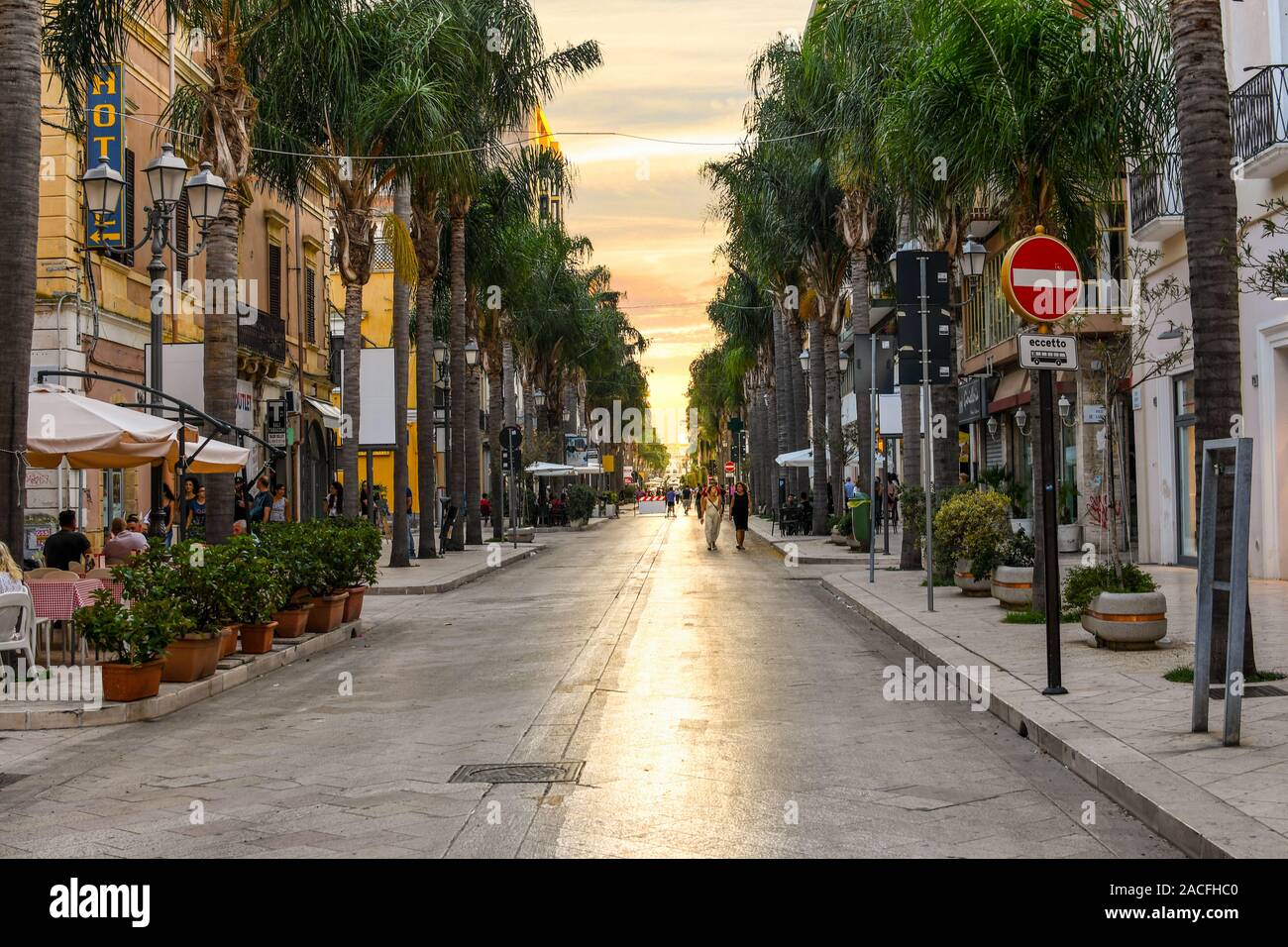 Pedestrians stroll down the main street in Brindisi, Italy, Corso ...
