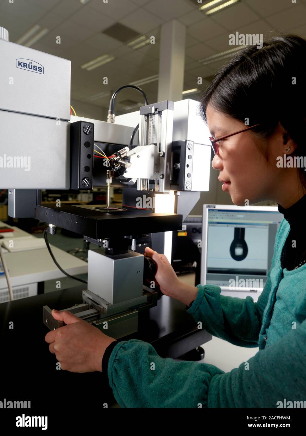 Drop shape analysis equipment. Researcher adjusting a drop shape ...