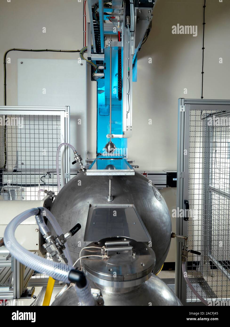 Using a manganese bath. Automated arm lowering a neutron source ...