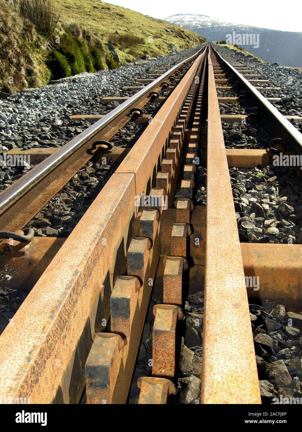 Rack and pinion railway. This toothed rail between the tracks (left and ...