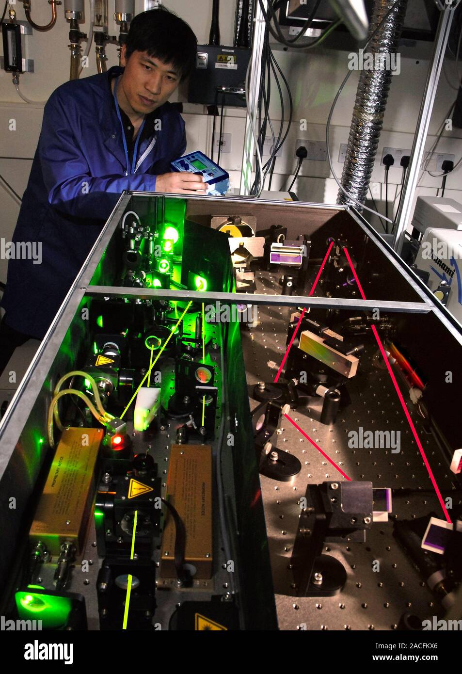 Hydrogen fuel cell research. Researcher working on a system for ...