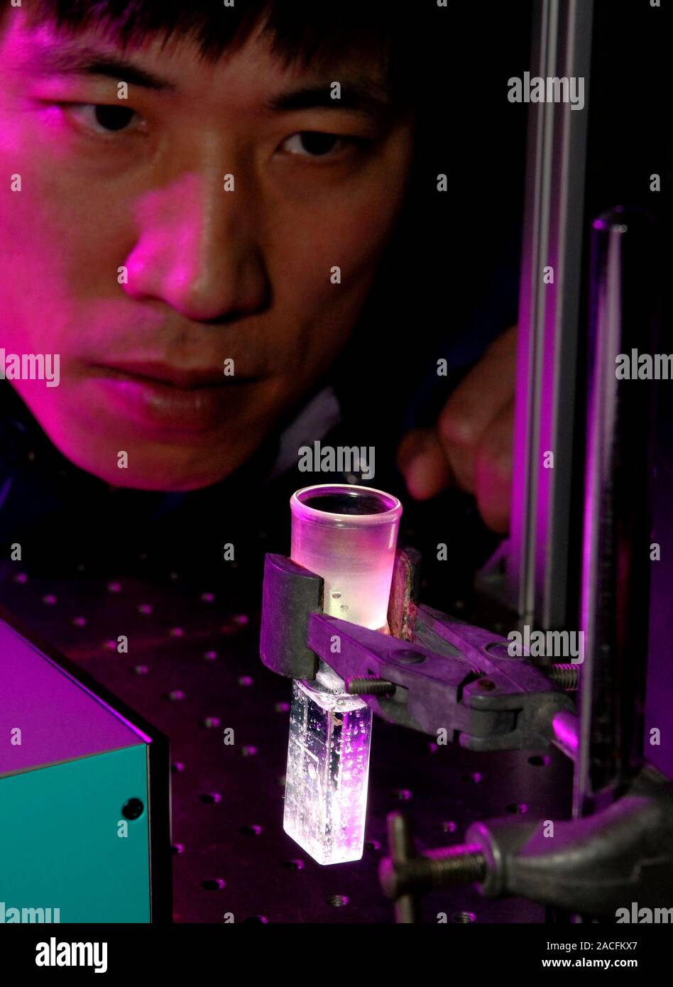 Hydrogen fuel cell research. Researcher working on a system for ...