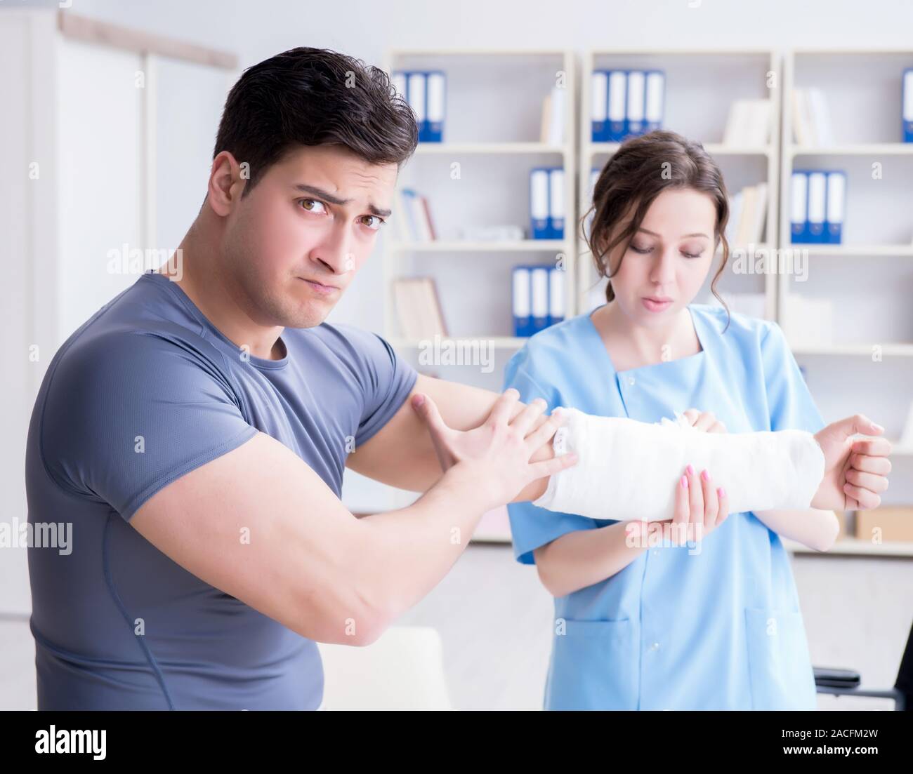The doctor and patient during check-up for injury in hospital Stock ...