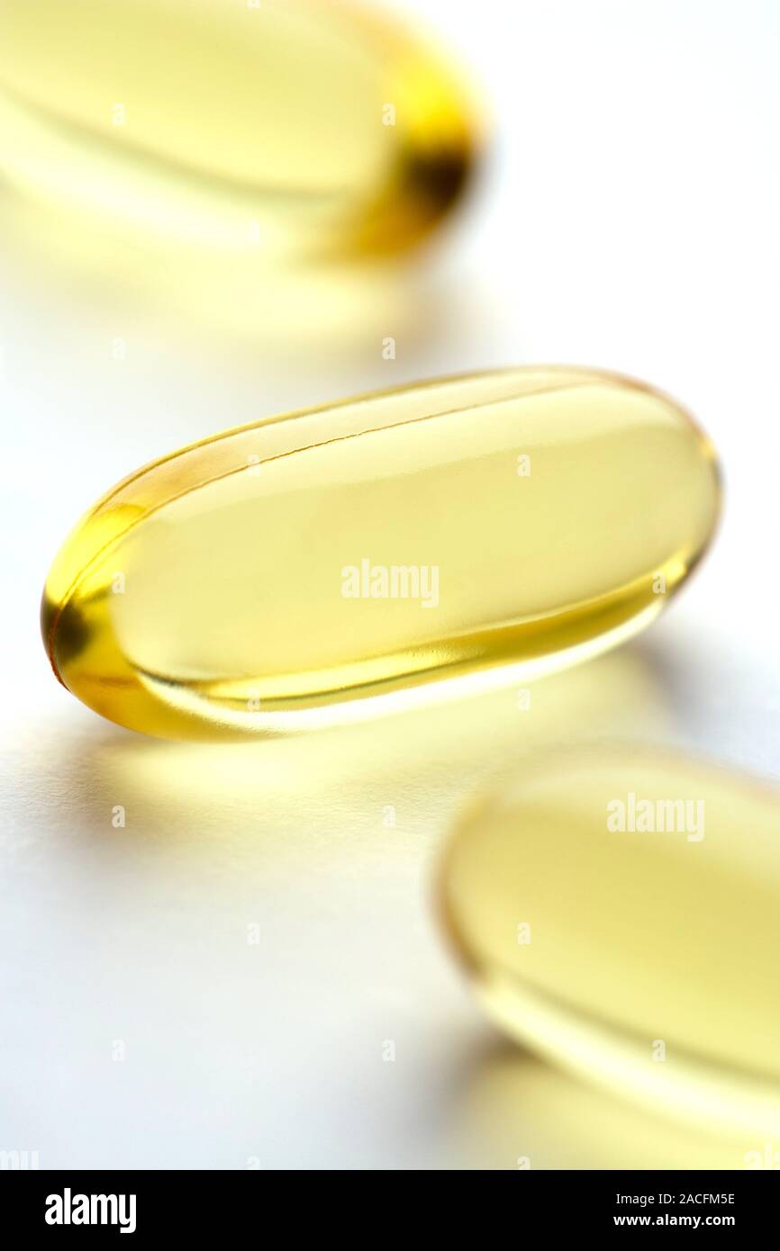 Fish oil capsules. Fish oil contains omega-3 fatty acids and vitamins A ...