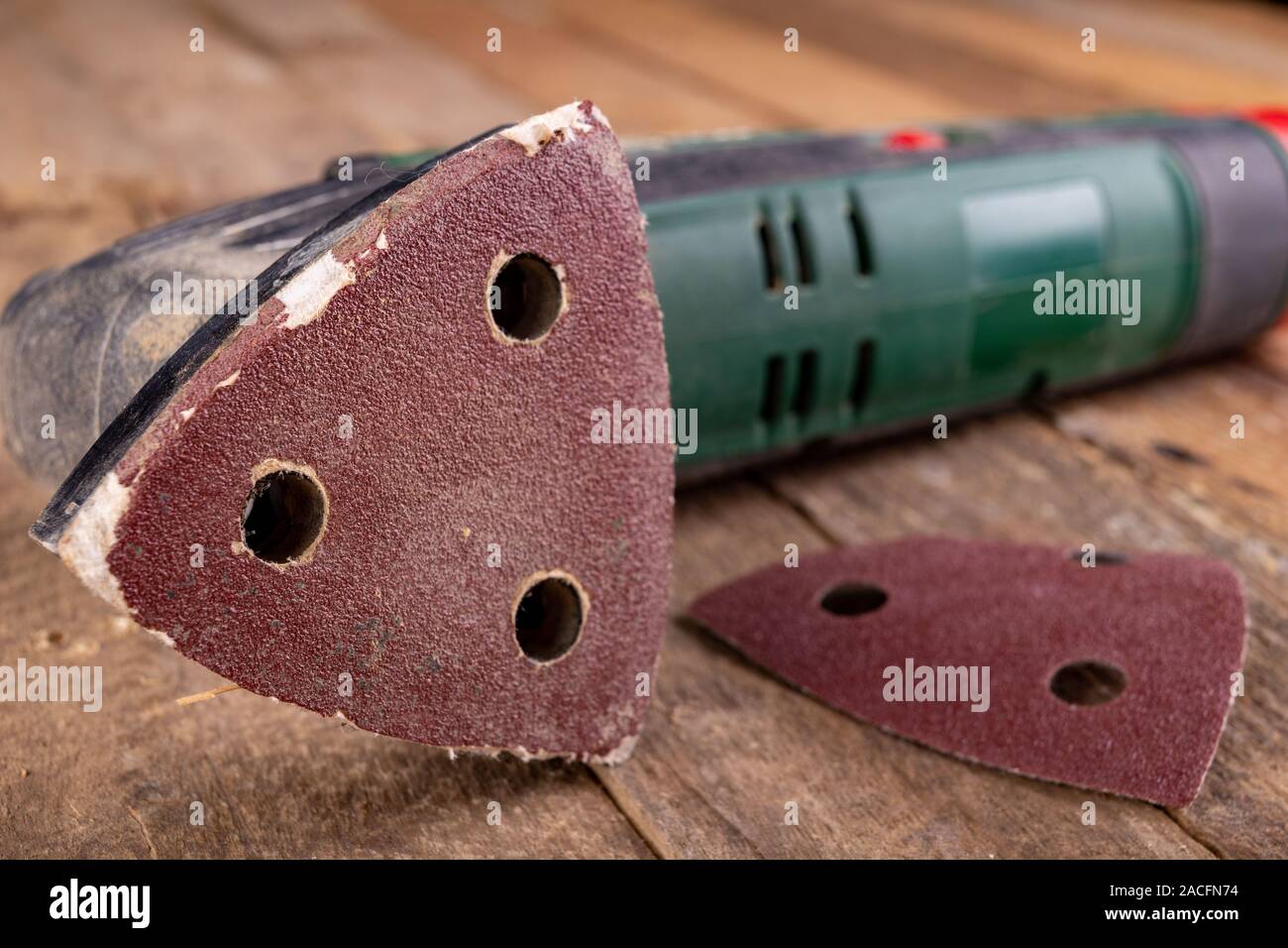 Rotary wood grinder with old sandpaper. Work tool in a carpentry ...