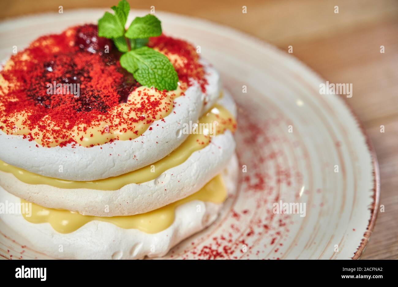 Meringue cake with whipped cream and berries Stock Photo - Alamy