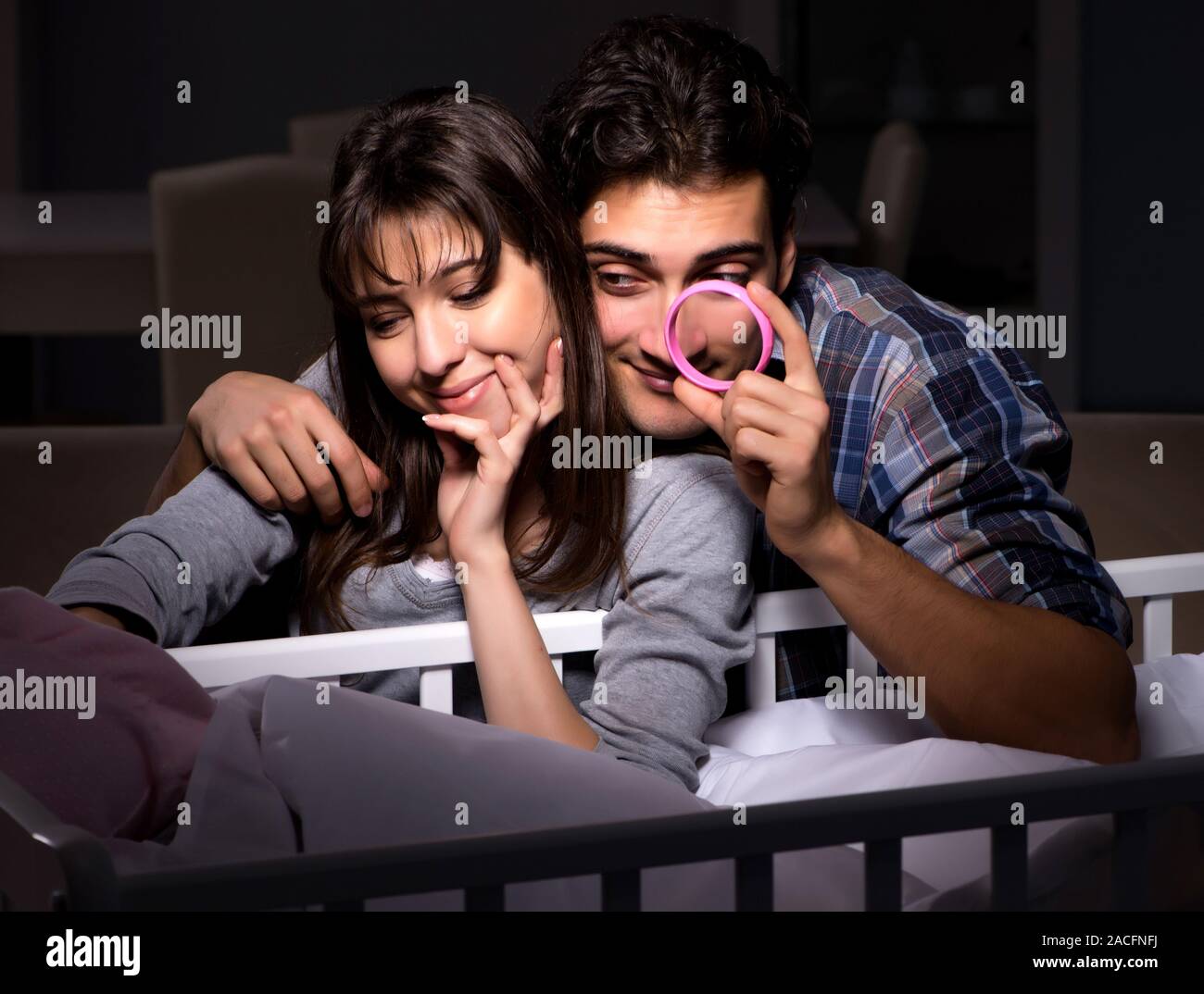 The young parents sleepless with newborn baby at night Stock Photo - Alamy