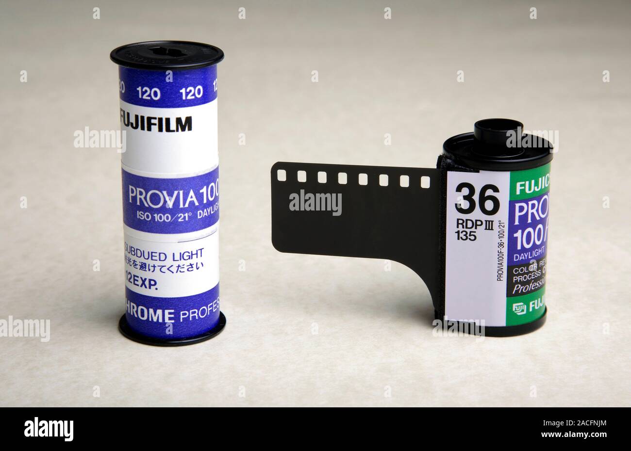 Photographic colour slide film. Medium format roll film (left) and a ...