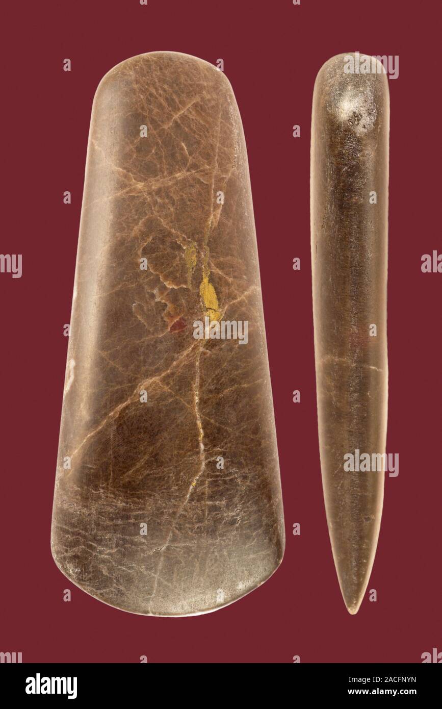Stone axe head. Front view and side view of a modern polished stone axe ...