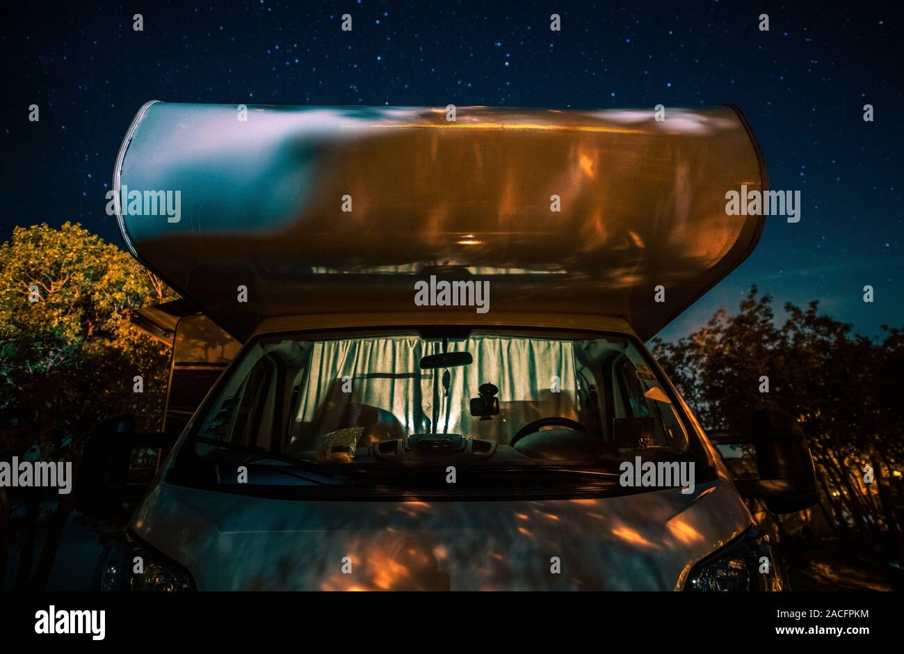 Night in RV Camper Van Motorhome Under Starry Sky. Motor Coach Front ...