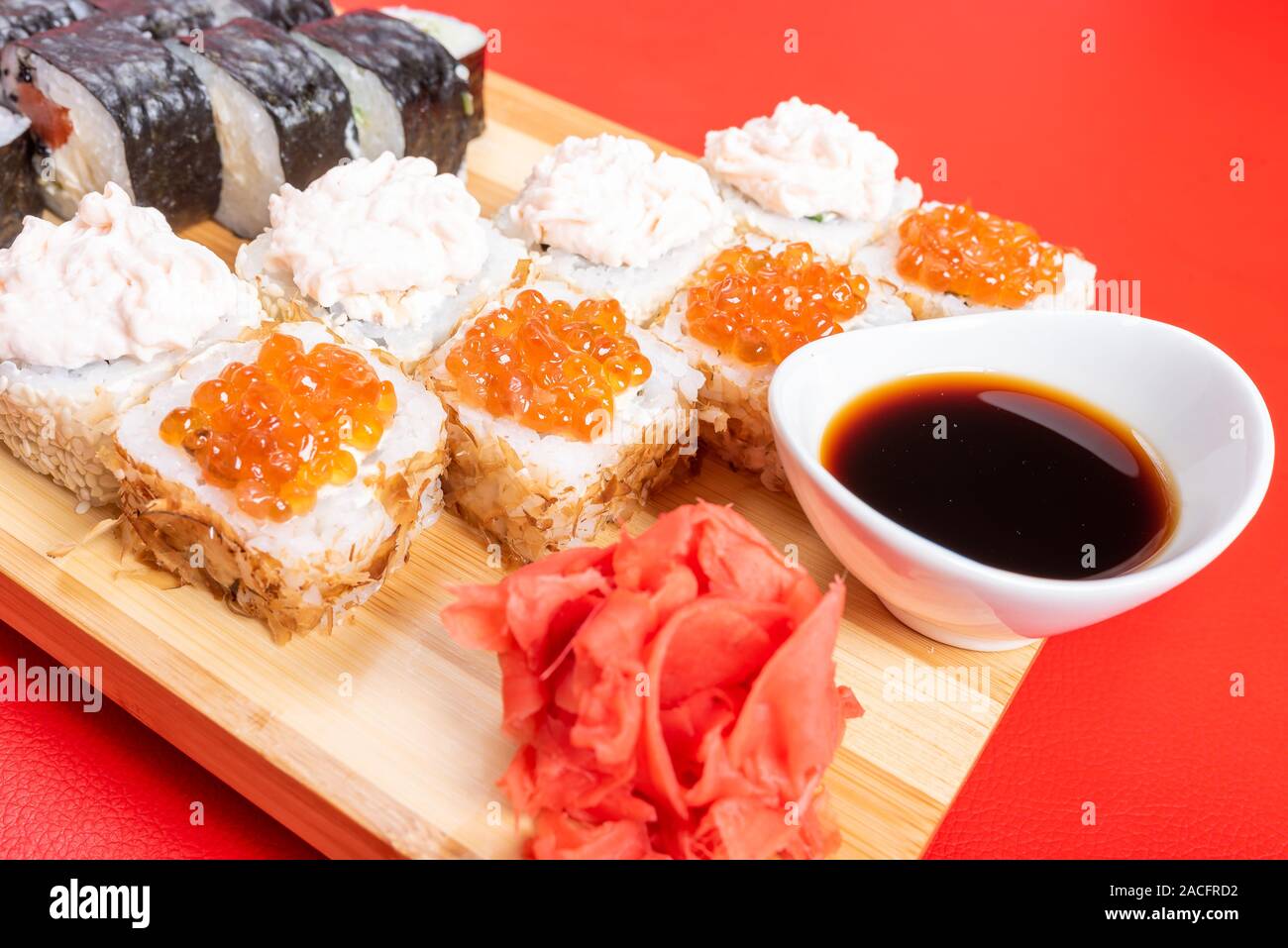 Set of rolls with salmon, red caviar, and flying fish. With krill ...