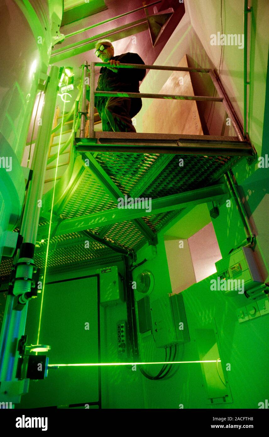 LIDAR laser atmospheric research. Researcher monitoring a LIDAR (Light ...